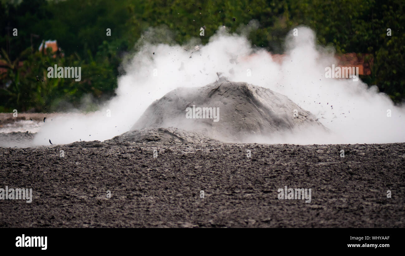 mud volcano with bursting bubble bledug kuwu. volcanic plateau with ...