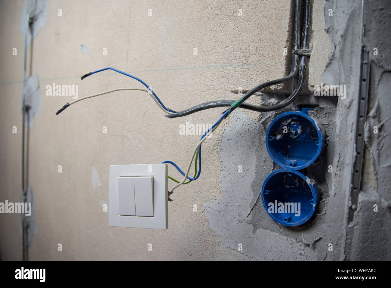 Replacing the electrical outlet in the wall of the house Stock Photo ...