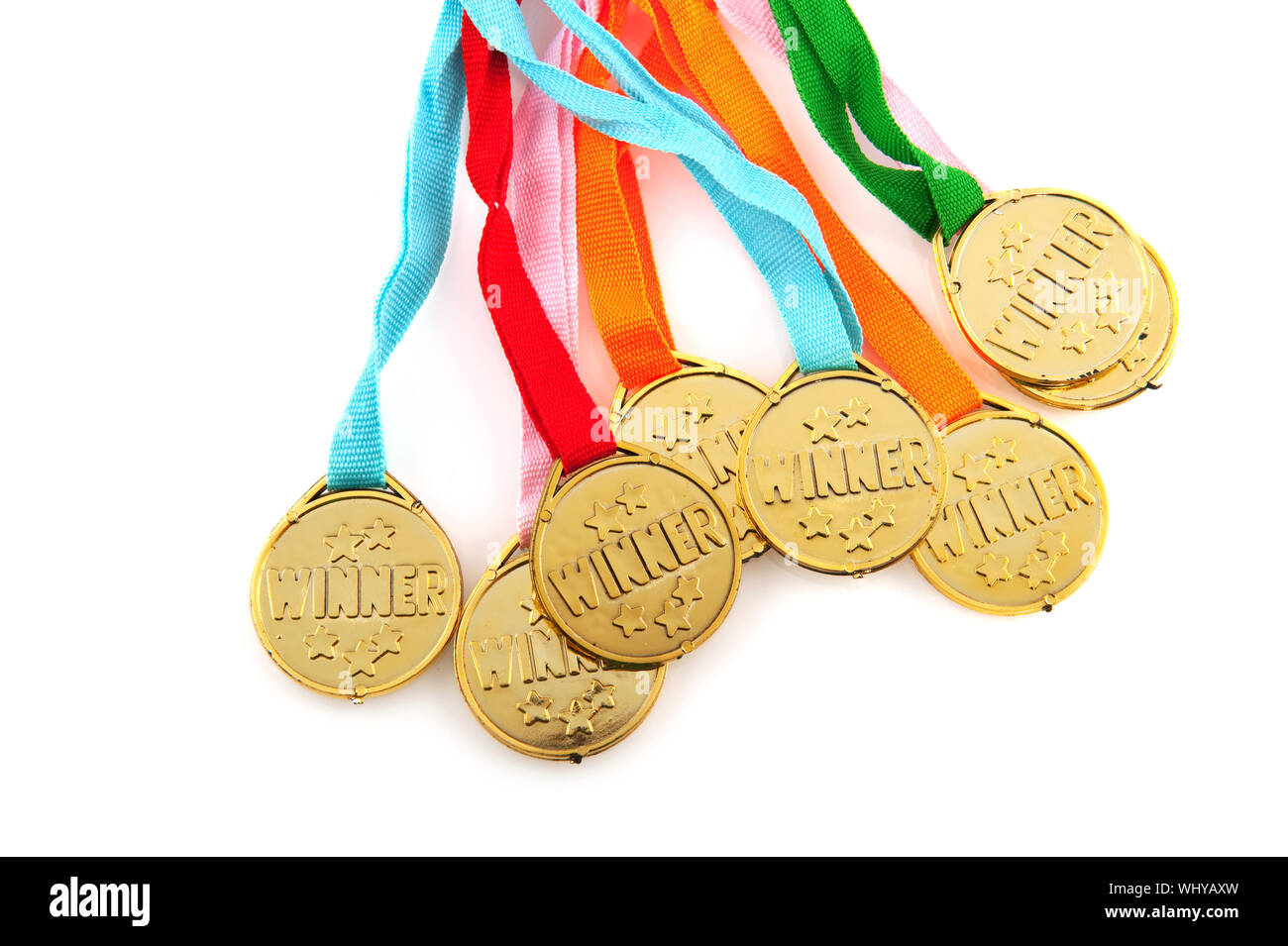 Many colorful golden medals for the winners Stock Photo - Alamy
