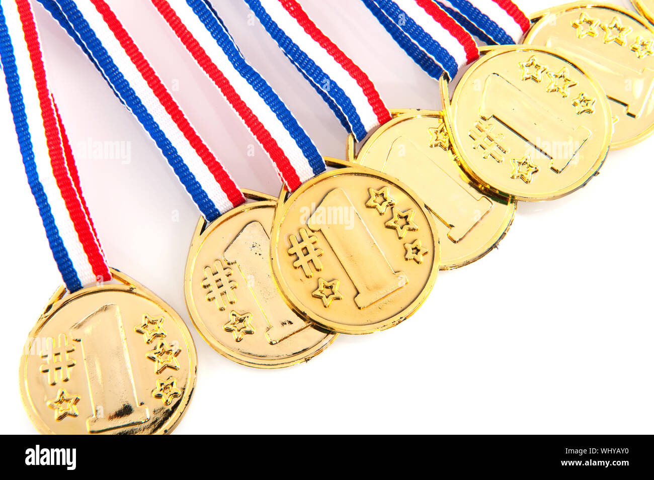 Many colorful golden medals for the winners Stock Photo - Alamy