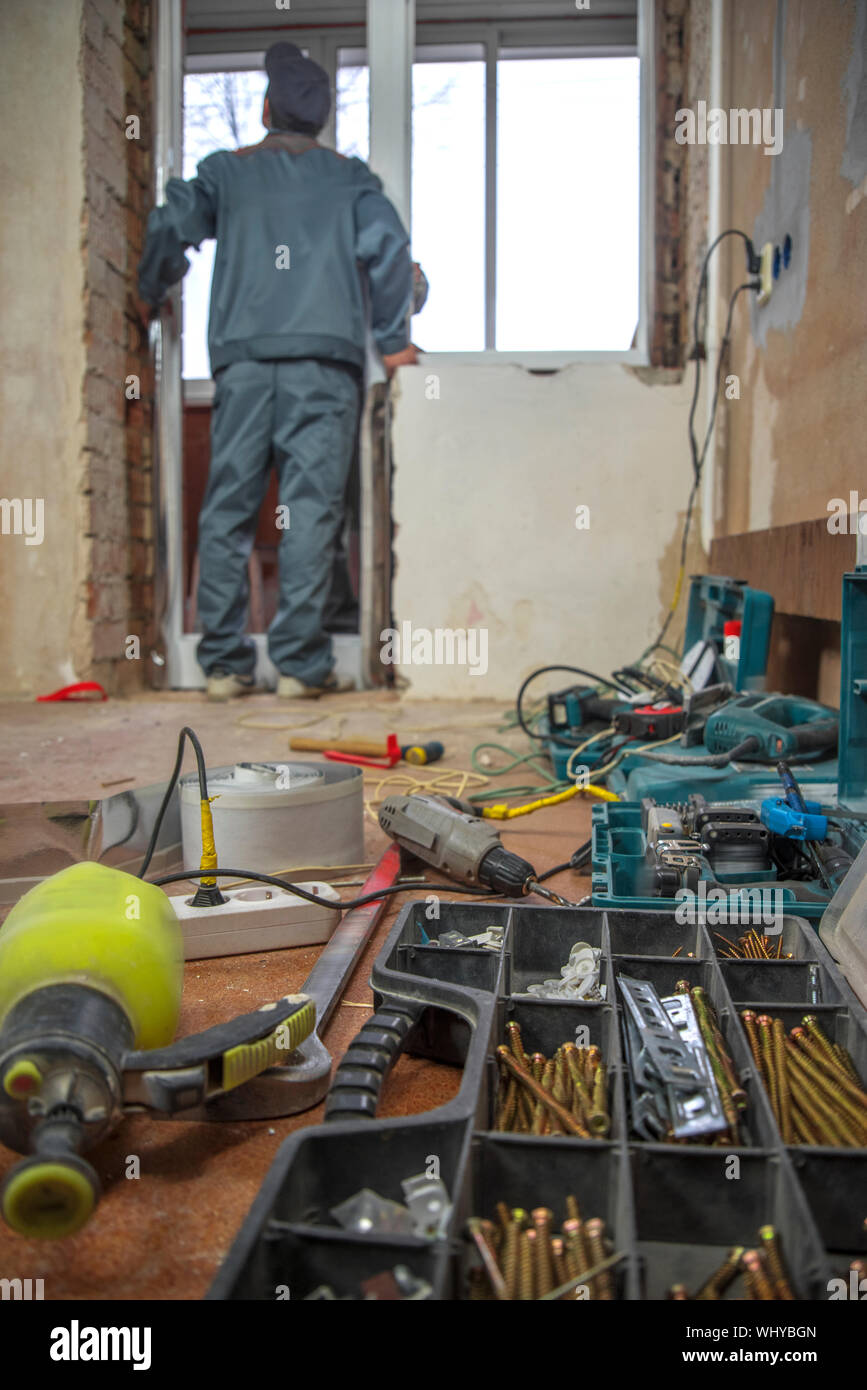 Installing windows and doors in the apartment Stock Photo - Alamy