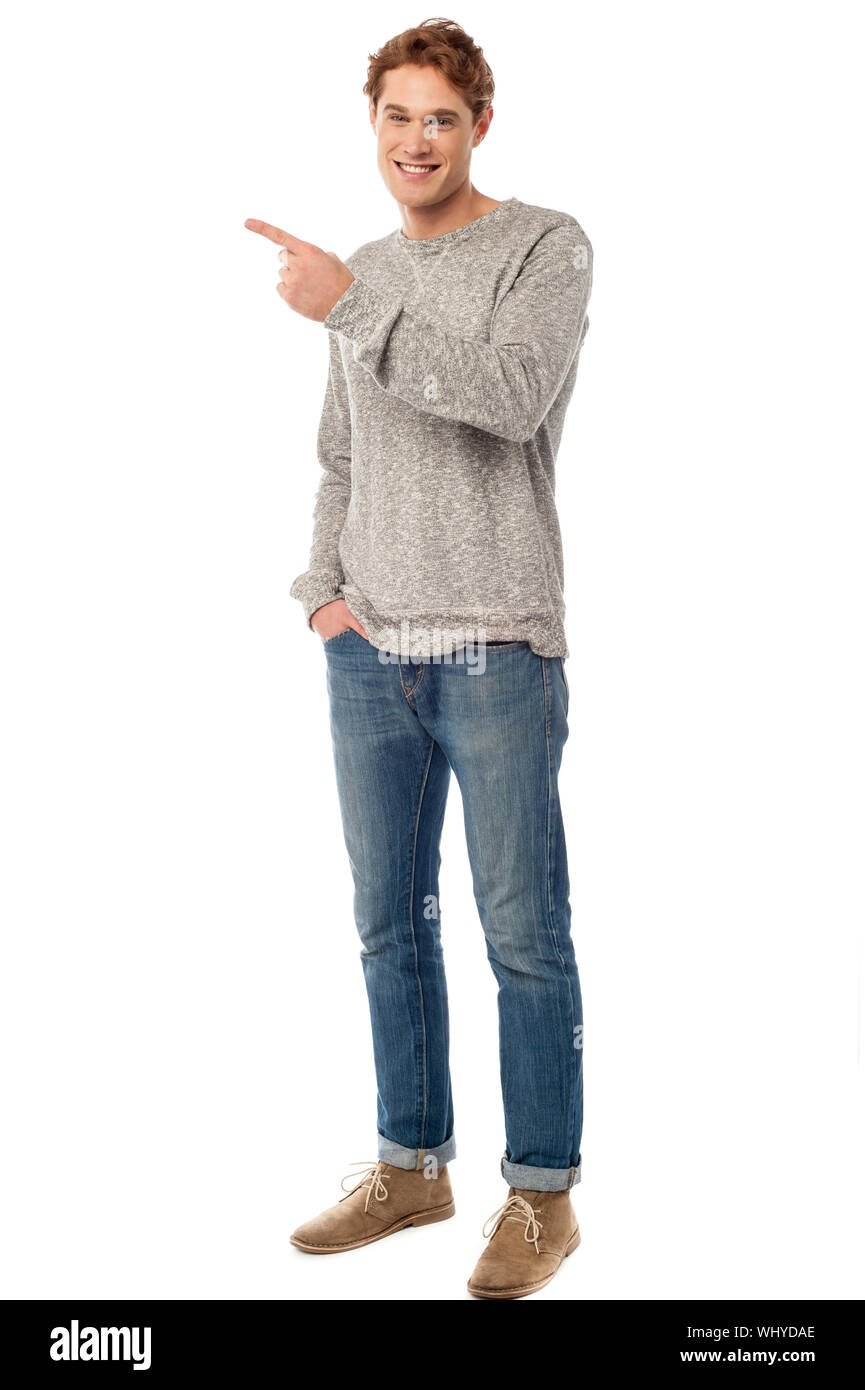 Fashion guy pointing at something Stock Photo - Alamy
