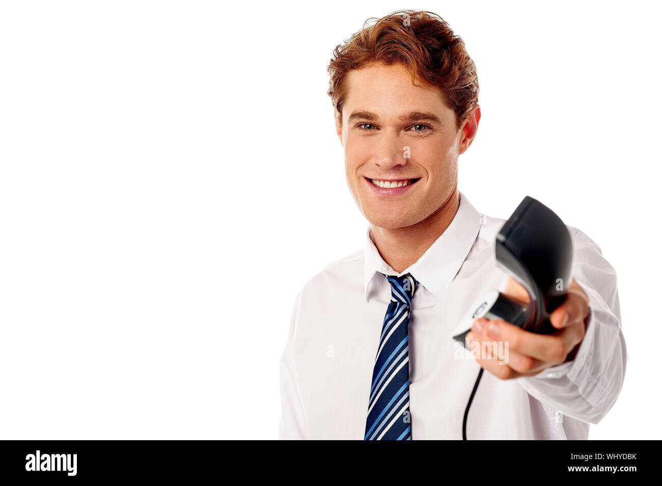 Male assistant handing over phone receiver Stock Photo - Alamy