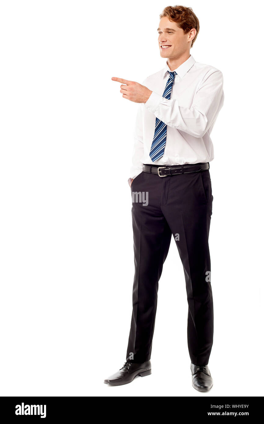 Handsome corporate male facing camera, pointing away Stock Photo - Alamy