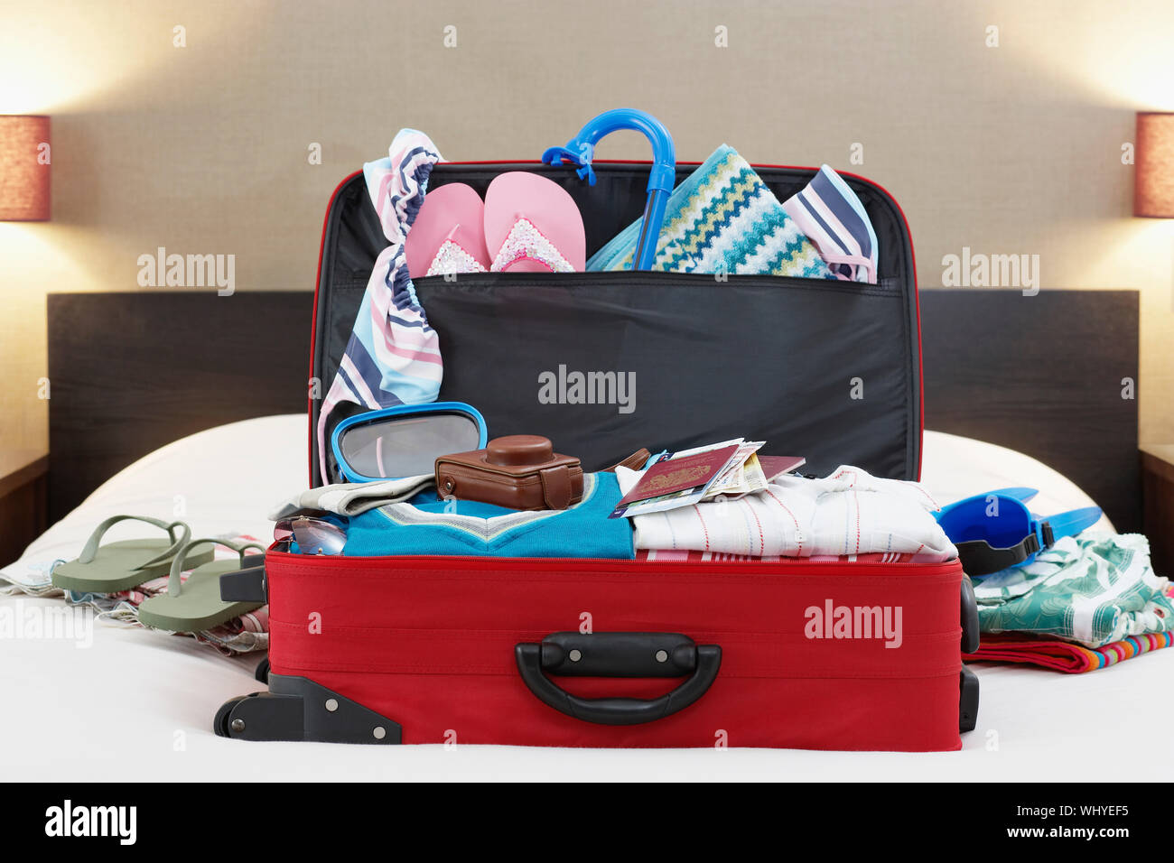 Suitcase on bed inside hotel hi-res stock photography and images - Alamy