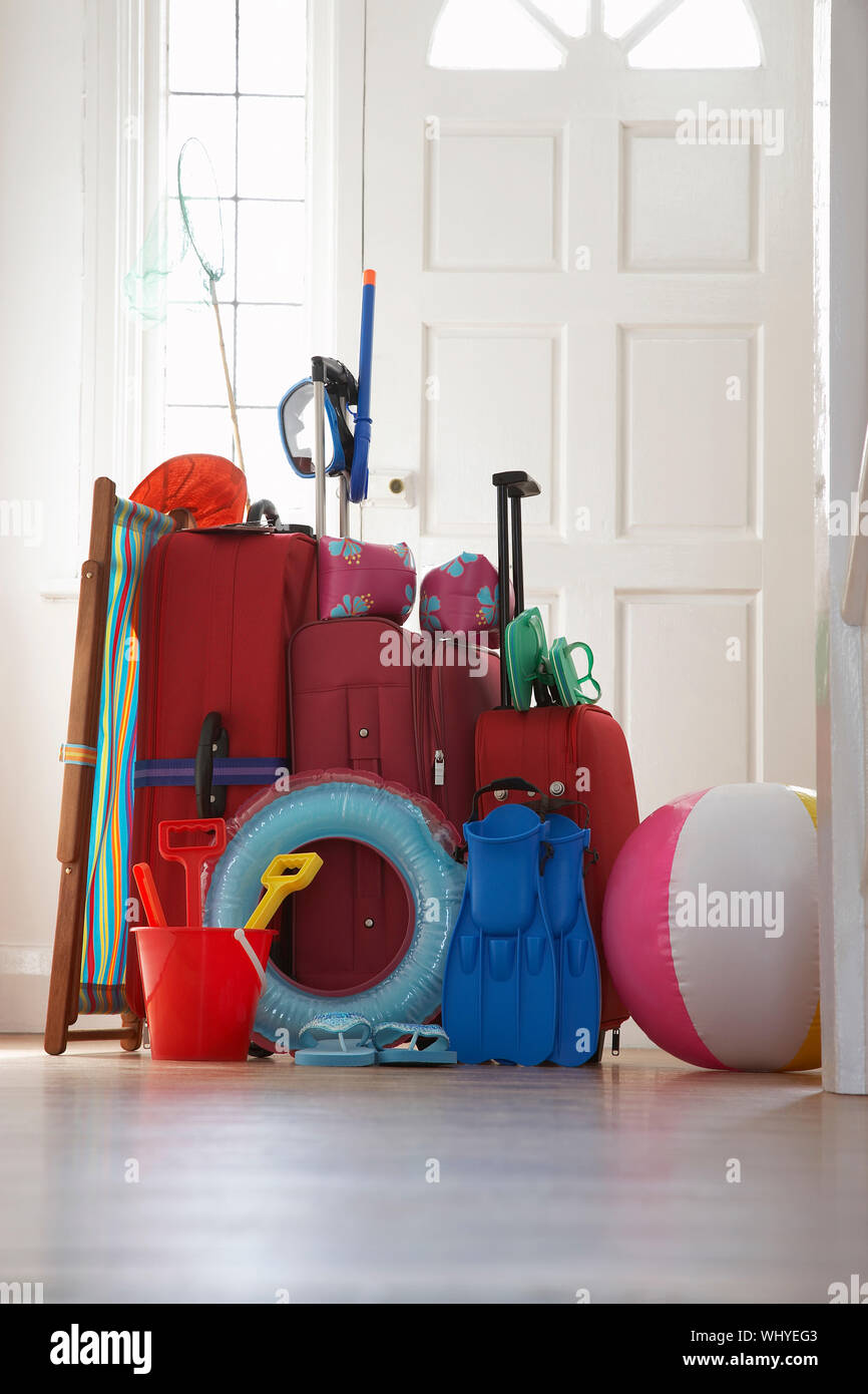 Packed luggage standing in hallway Stock Photo - Alamy