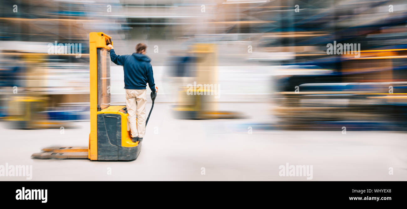 Forklift Worker In Motion AT Work in Warehouse | Long Exposure Blurred ...