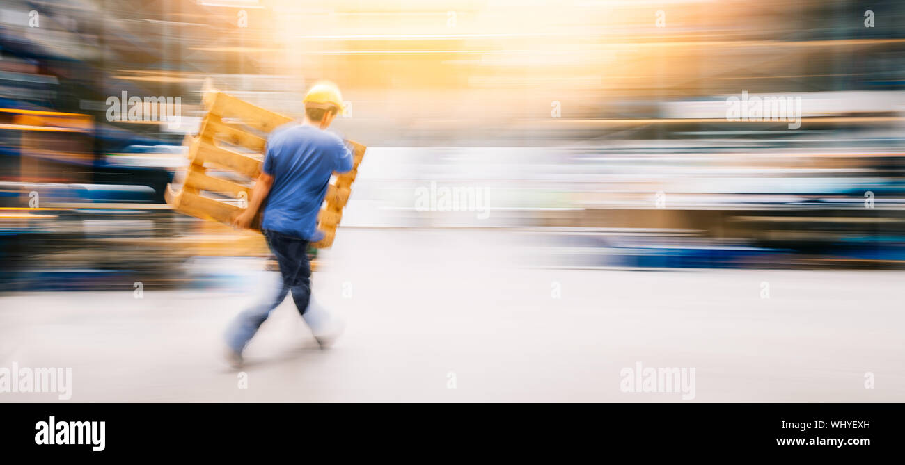 Worker In Motion | Man At Work Carrying a Forklift Pallet | Long ...