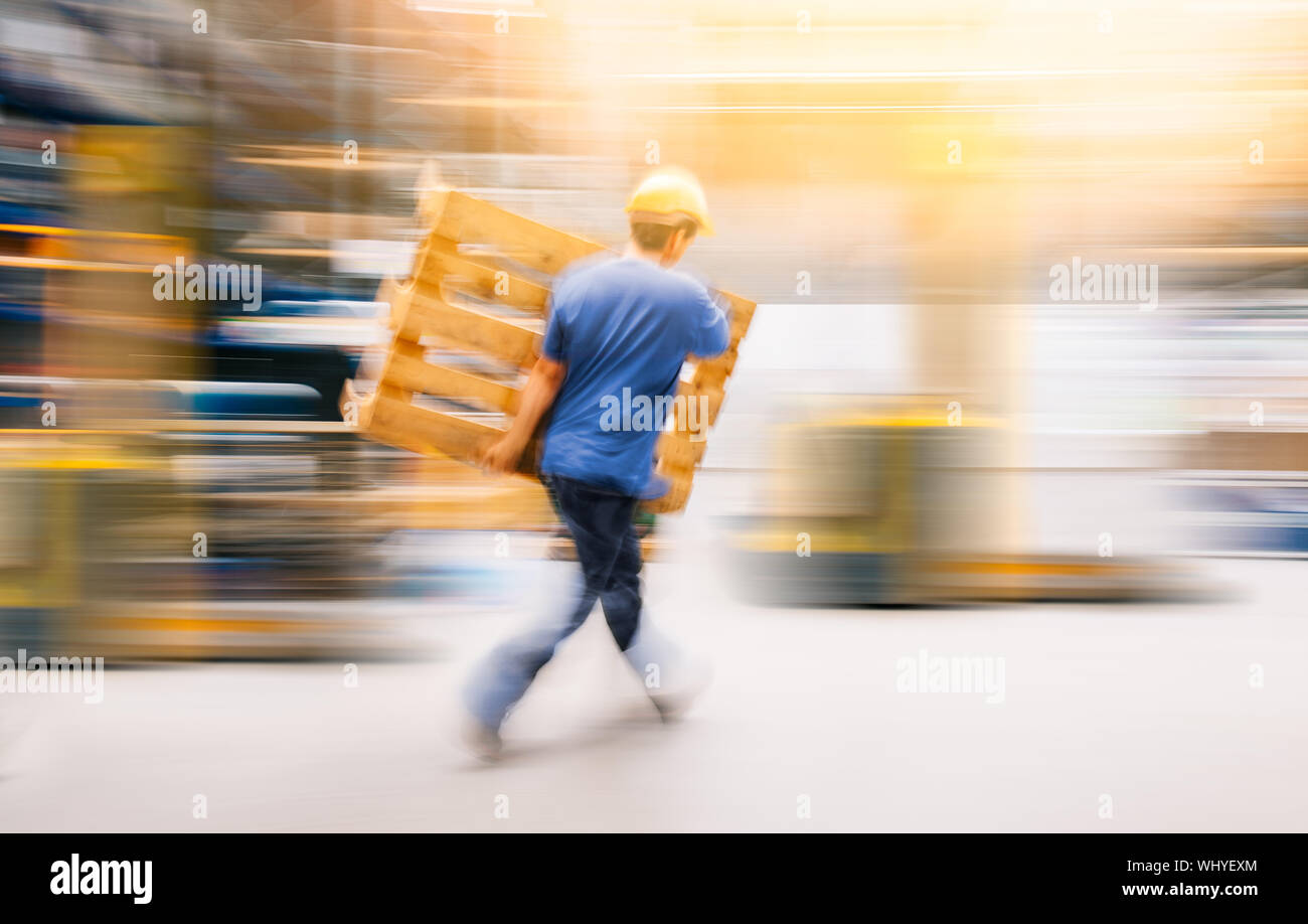 Worker In Motion | Man At Work Carrying a Forklift Pallet | Long ...