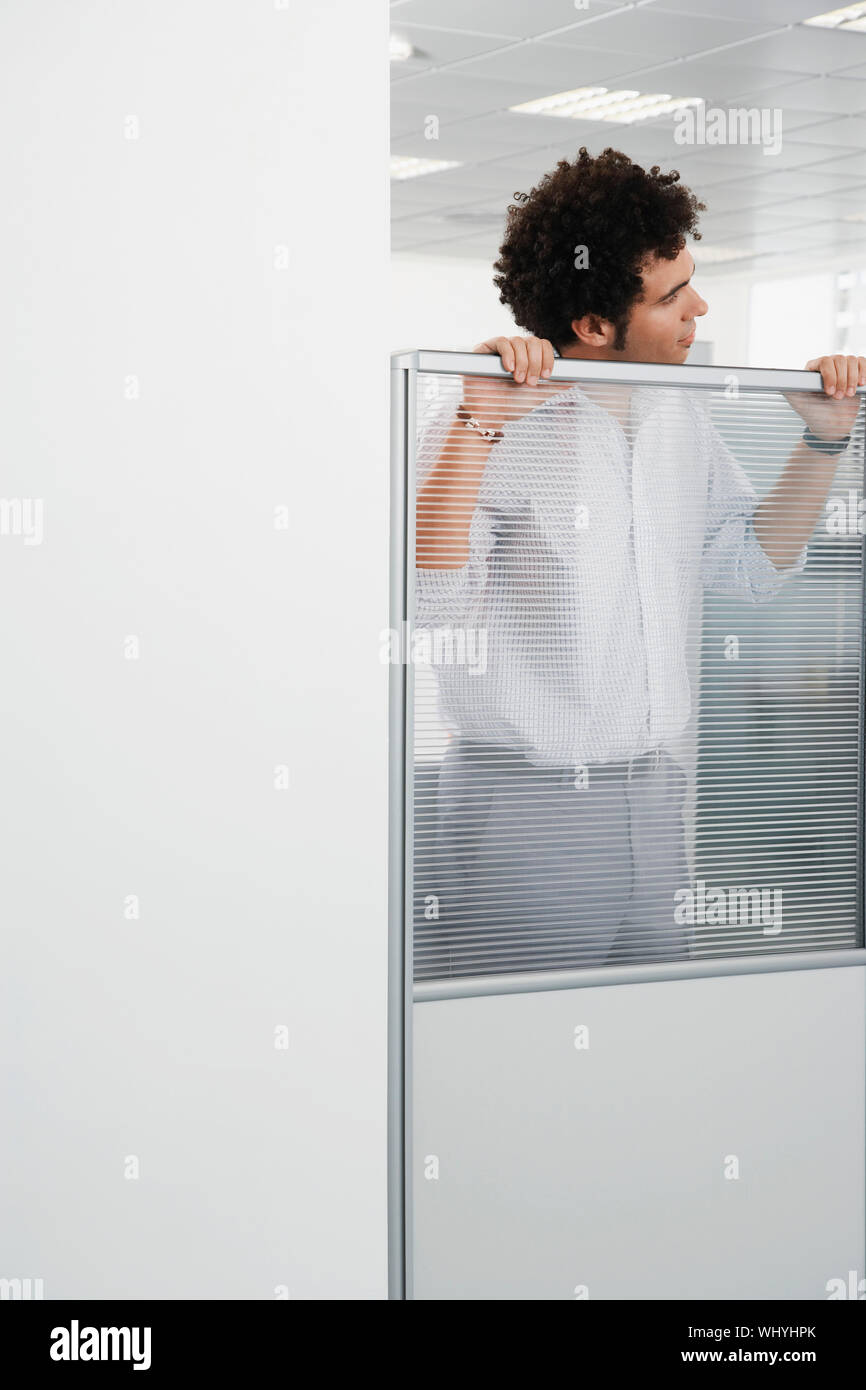 Office peering over cubicle wall hi-res stock photography and images ...