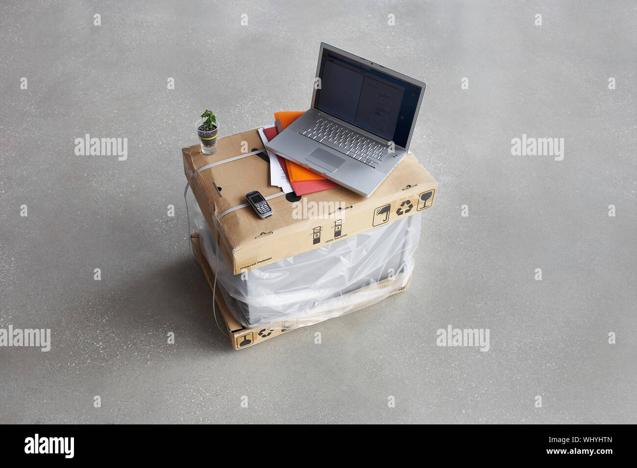 Elevated view of open laptop on top of boxes Stock Photo - Alamy
