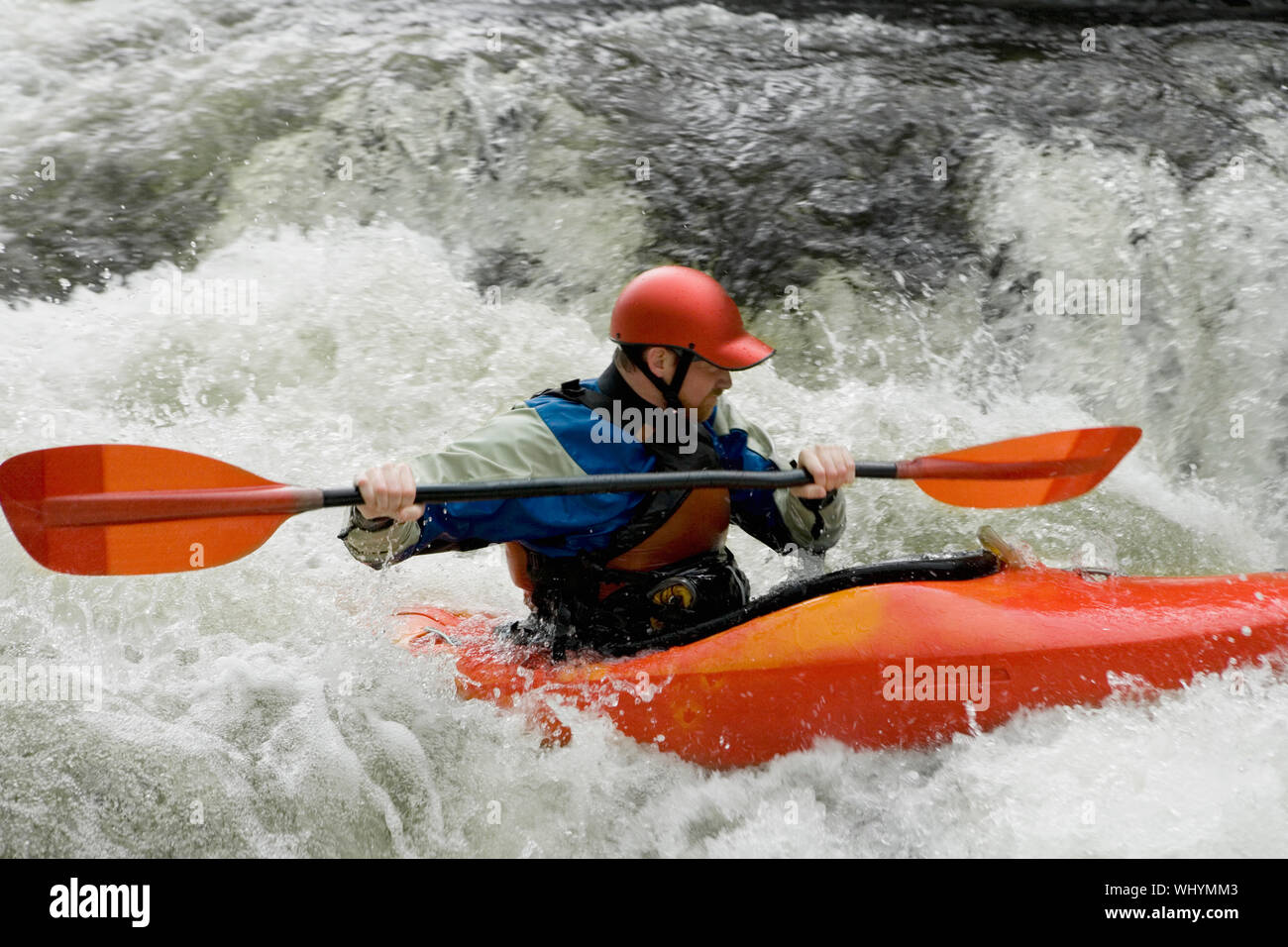 Side view of a man kayaking in rough river Stock Photo - Alamy