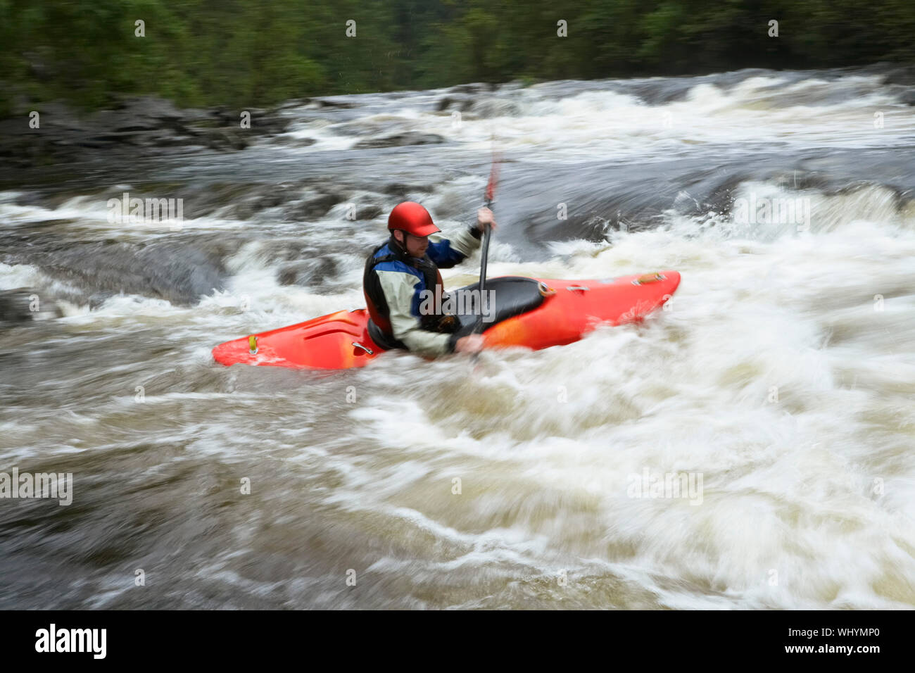 Side view of a man kayaking in rough river Stock Photo - Alamy