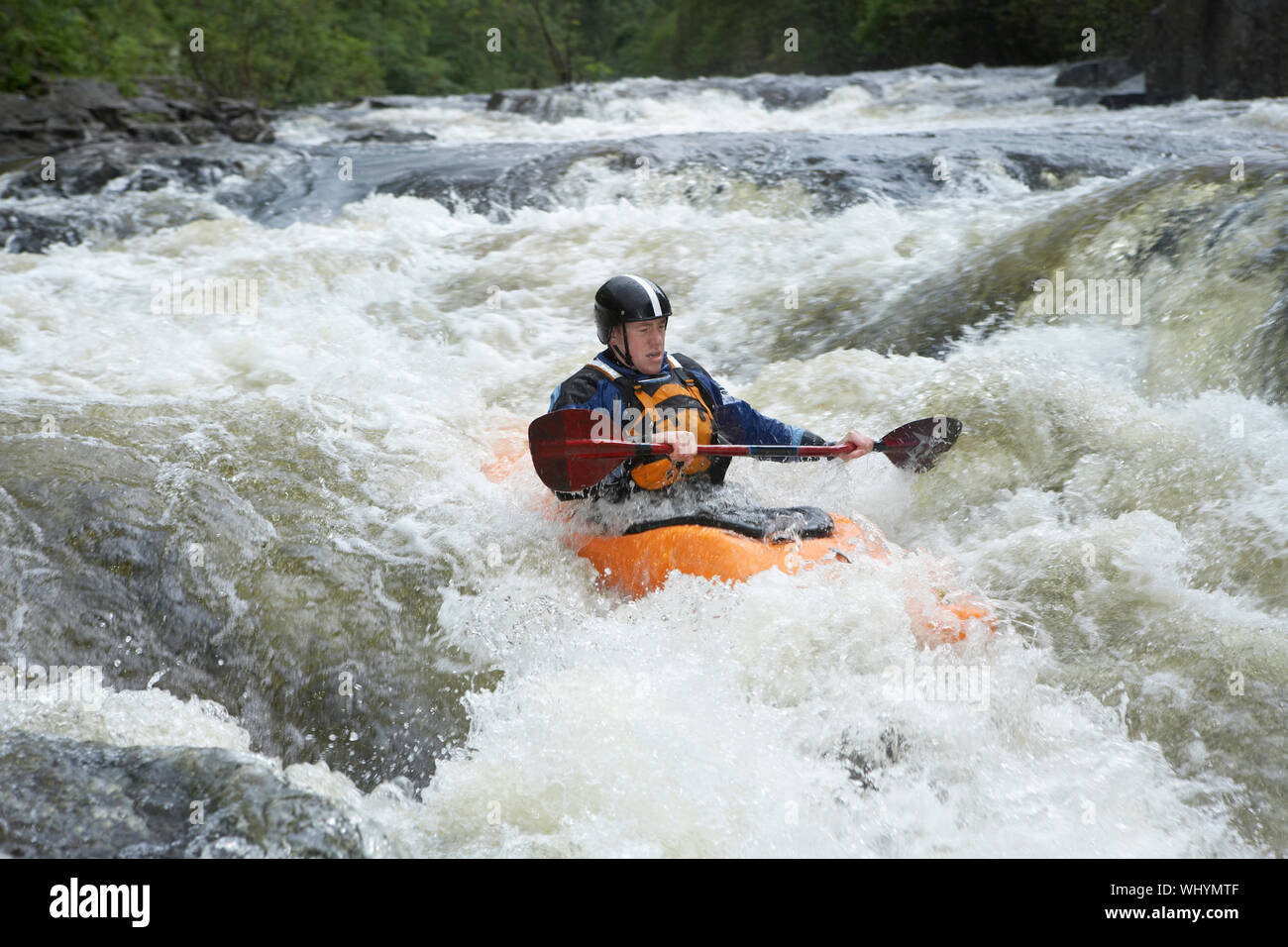 View of a man kayaking in rough river Stock Photo - Alamy