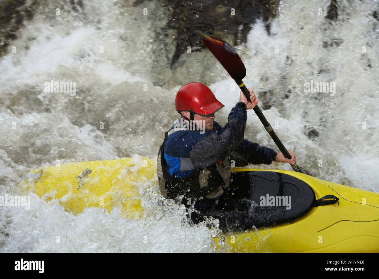 Side view of a man kayaking in rough river Stock Photo - Alamy