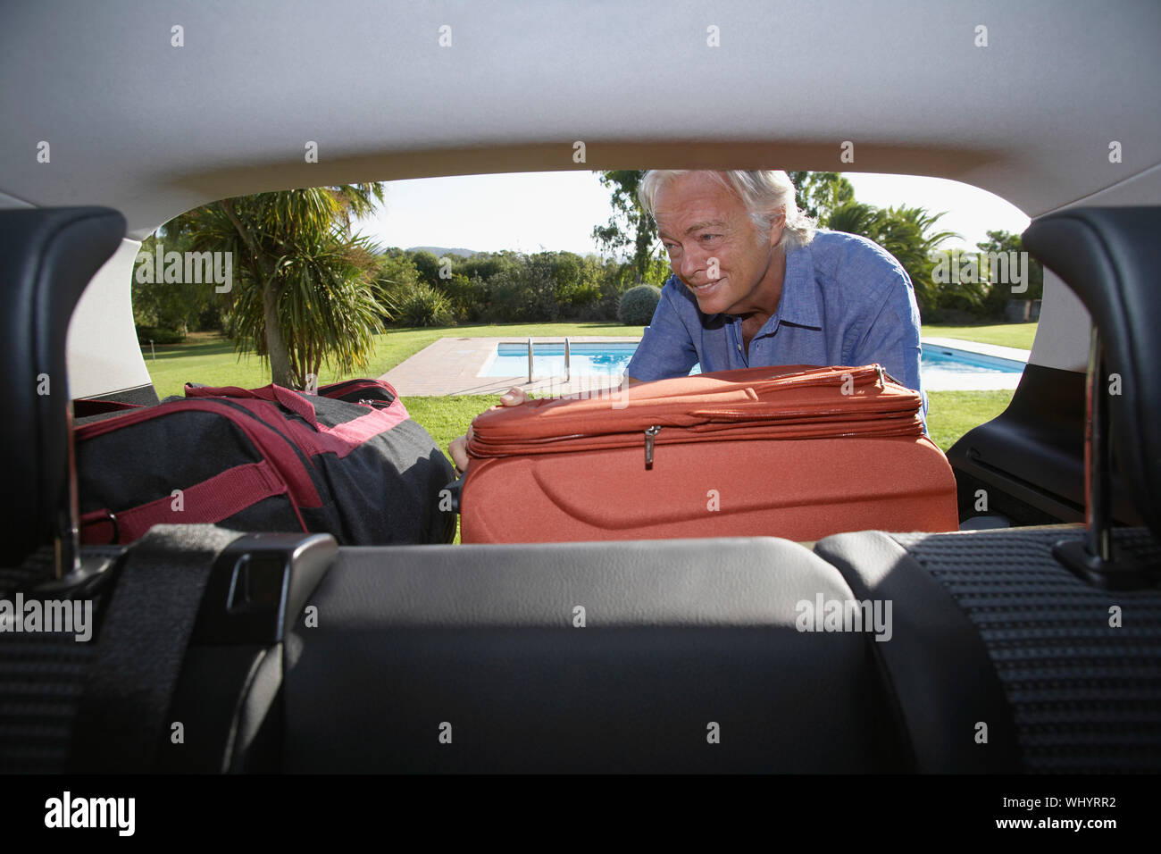 Man loading boot of car with luggage hi-res stock photography and ...