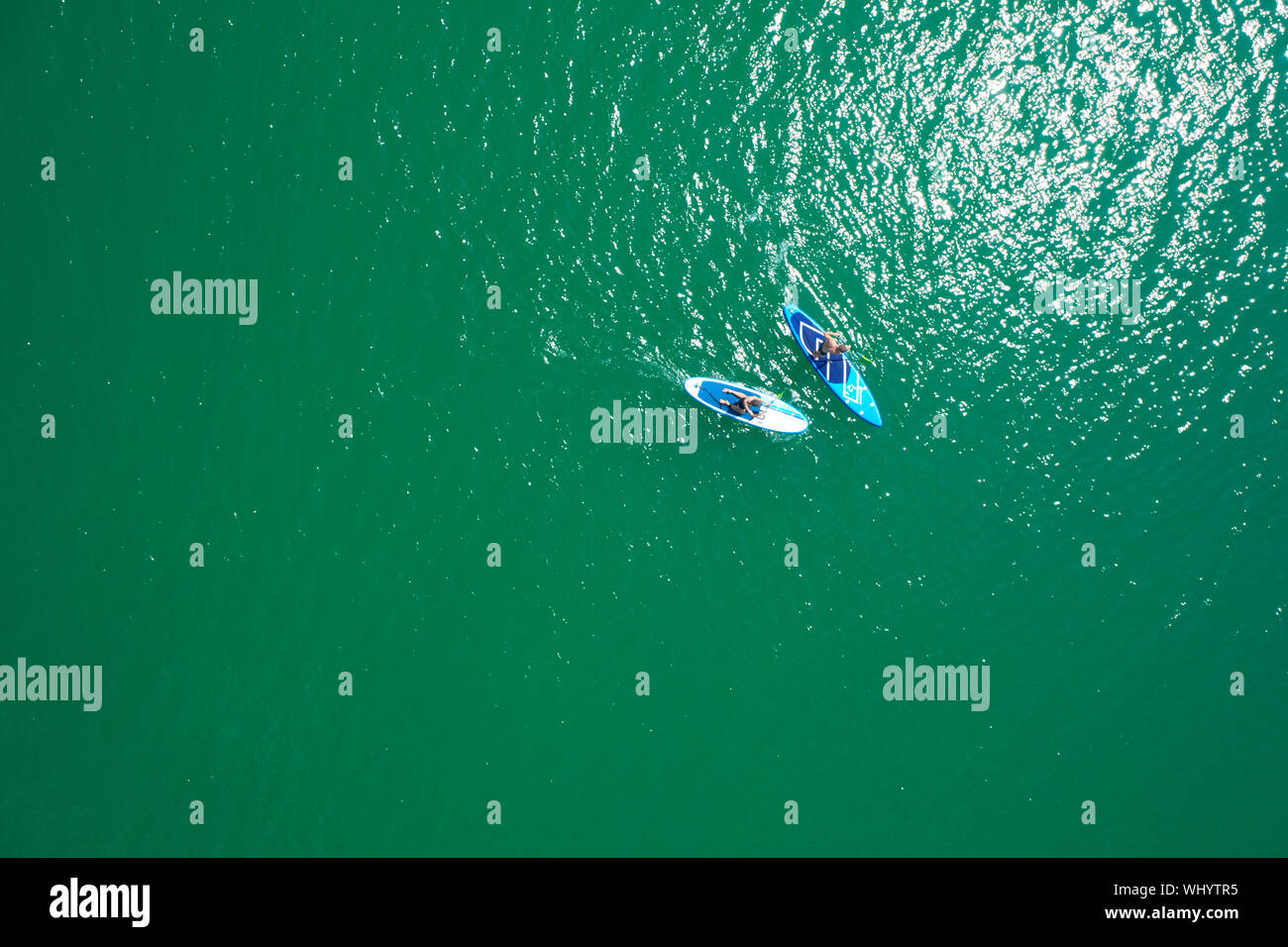 Aerial view of sup boards on the sea. Top view of two paddleboard on a ...