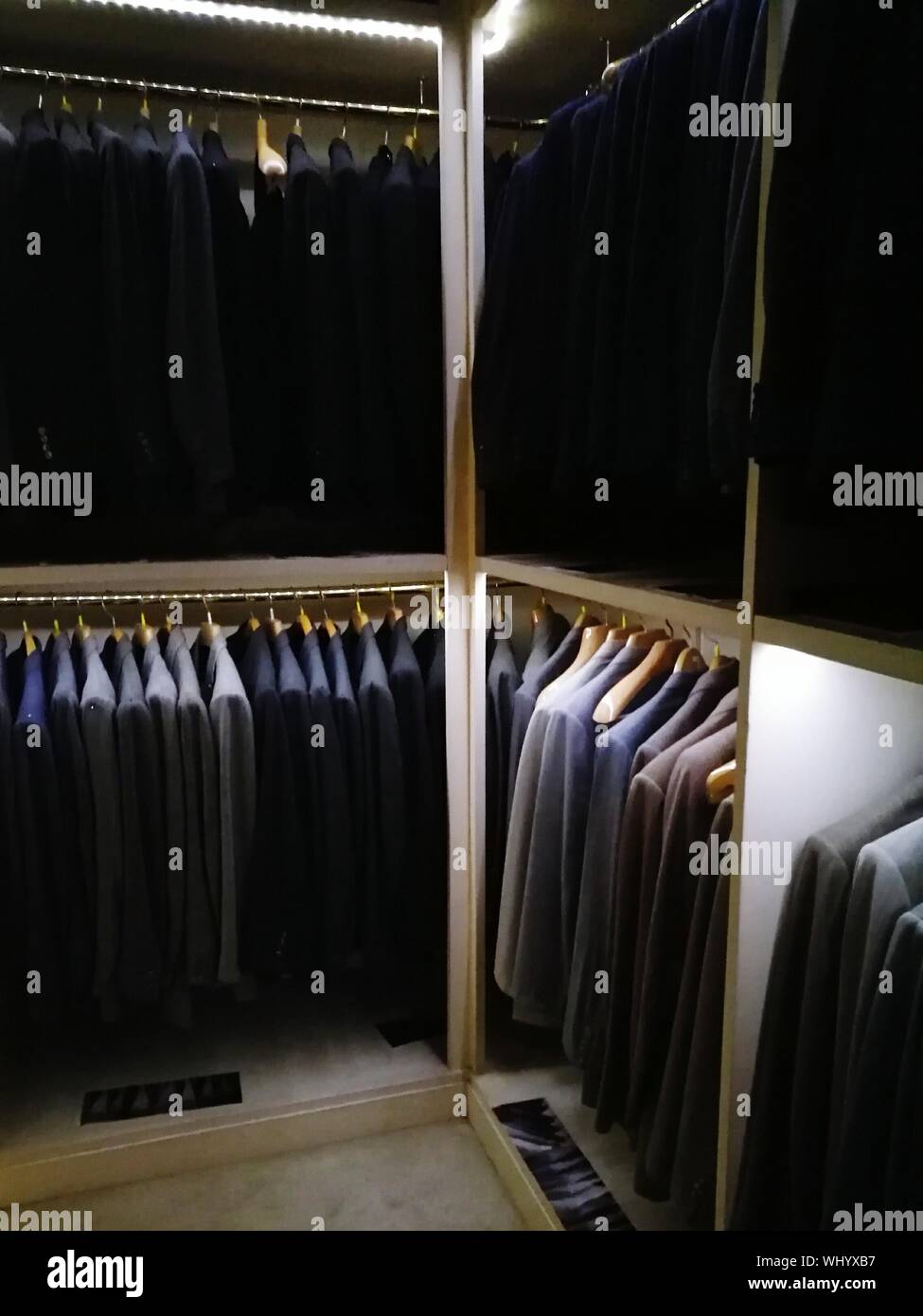 Suits hanging in closet hi-res stock photography and images - Alamy