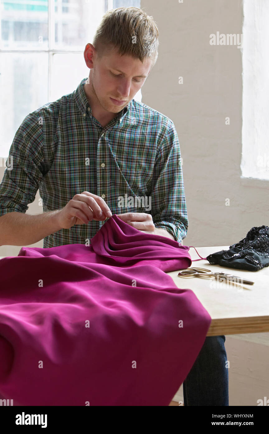 Sewing pink man hi-res stock photography and images - Alamy