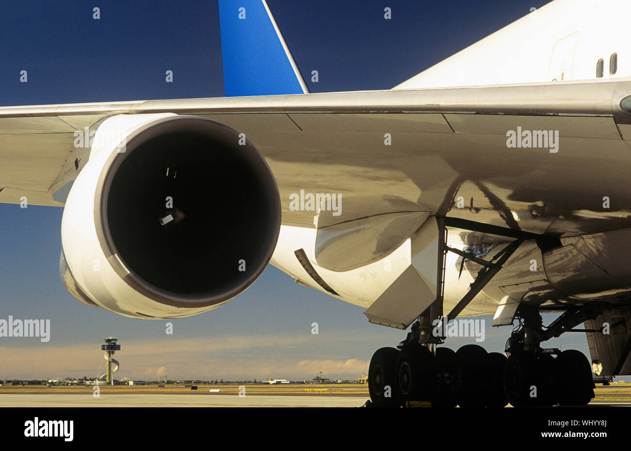 Man inspecting engine of passenger jet Stock Photo - Alamy