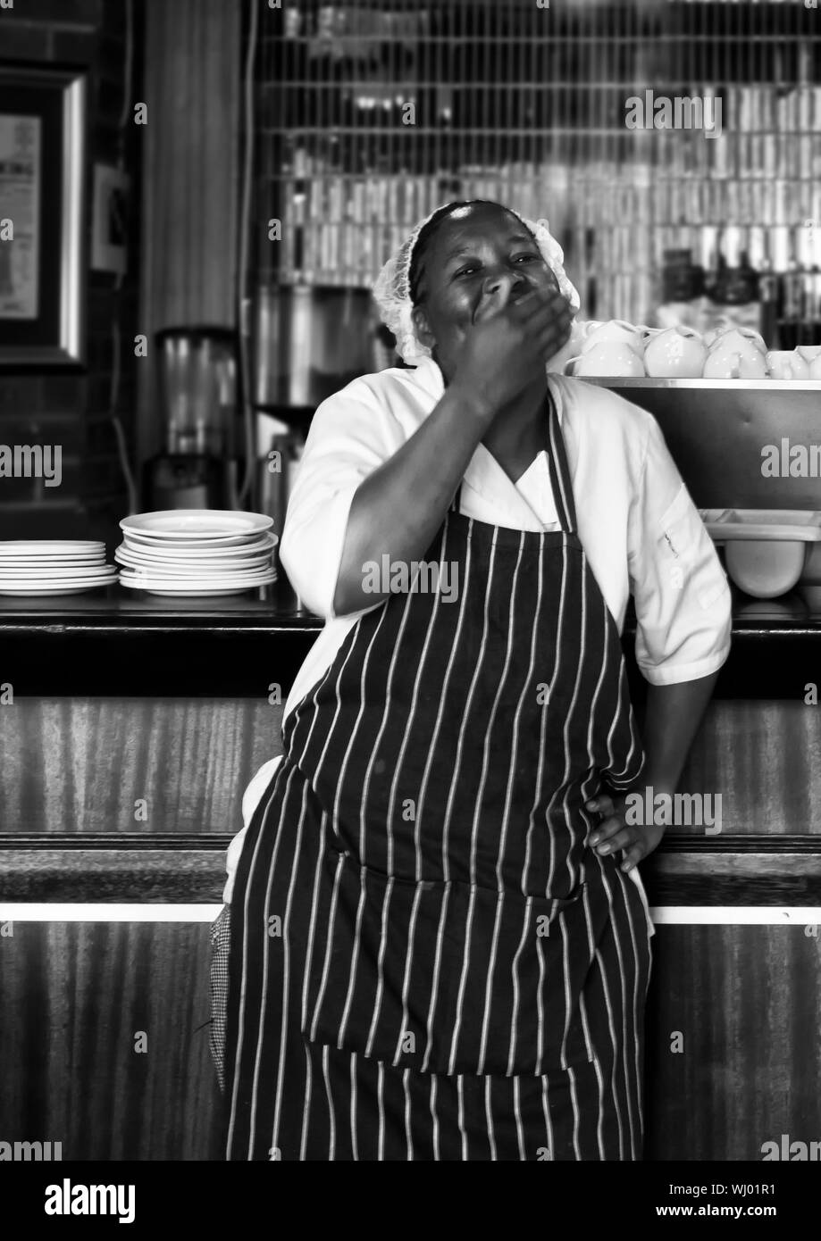 gaborone, botswana - November 17 2013 : shy, smilling, news cafe ...