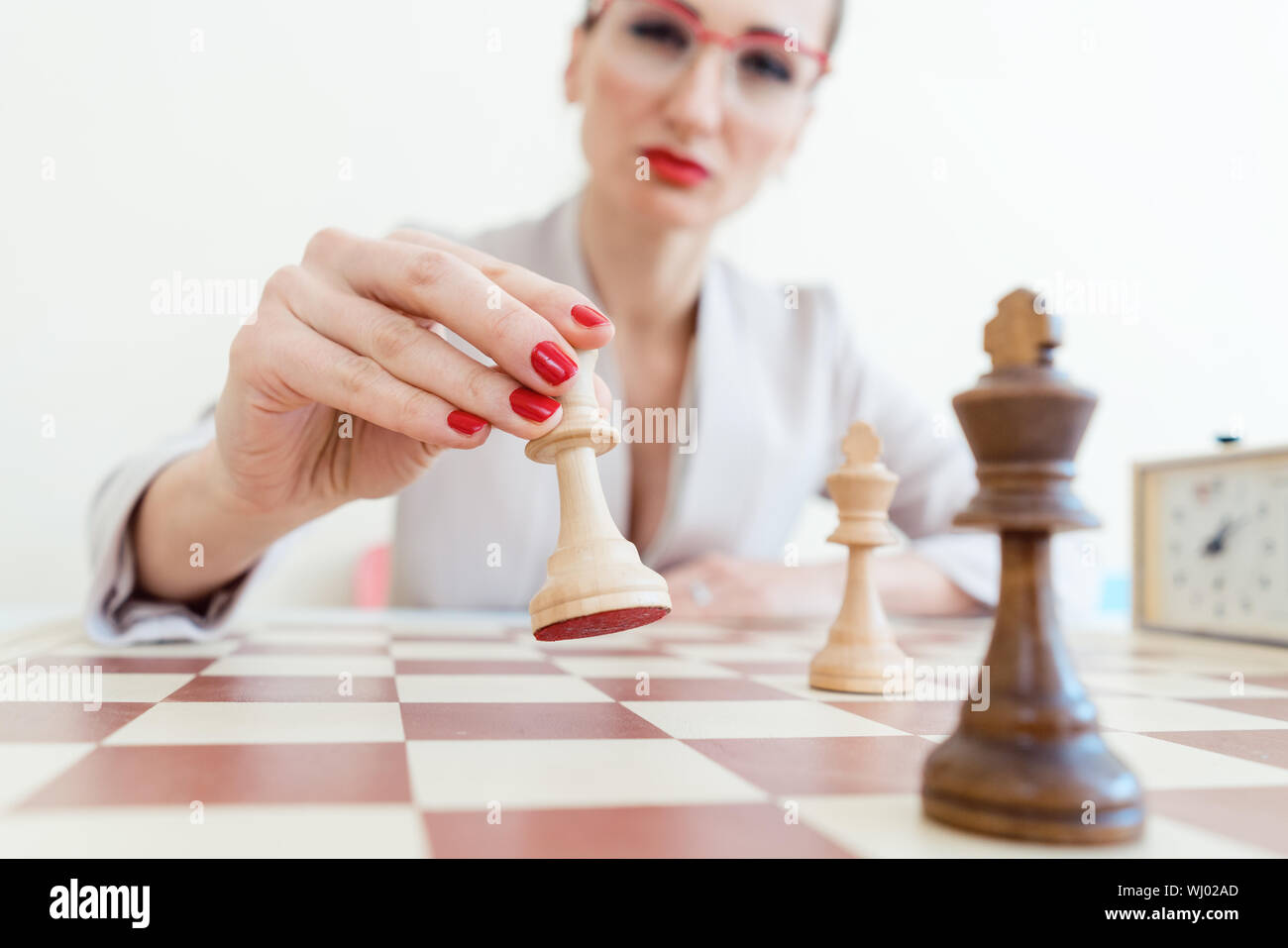 Hand holding chess piece hi-res stock photography and images - Alamy