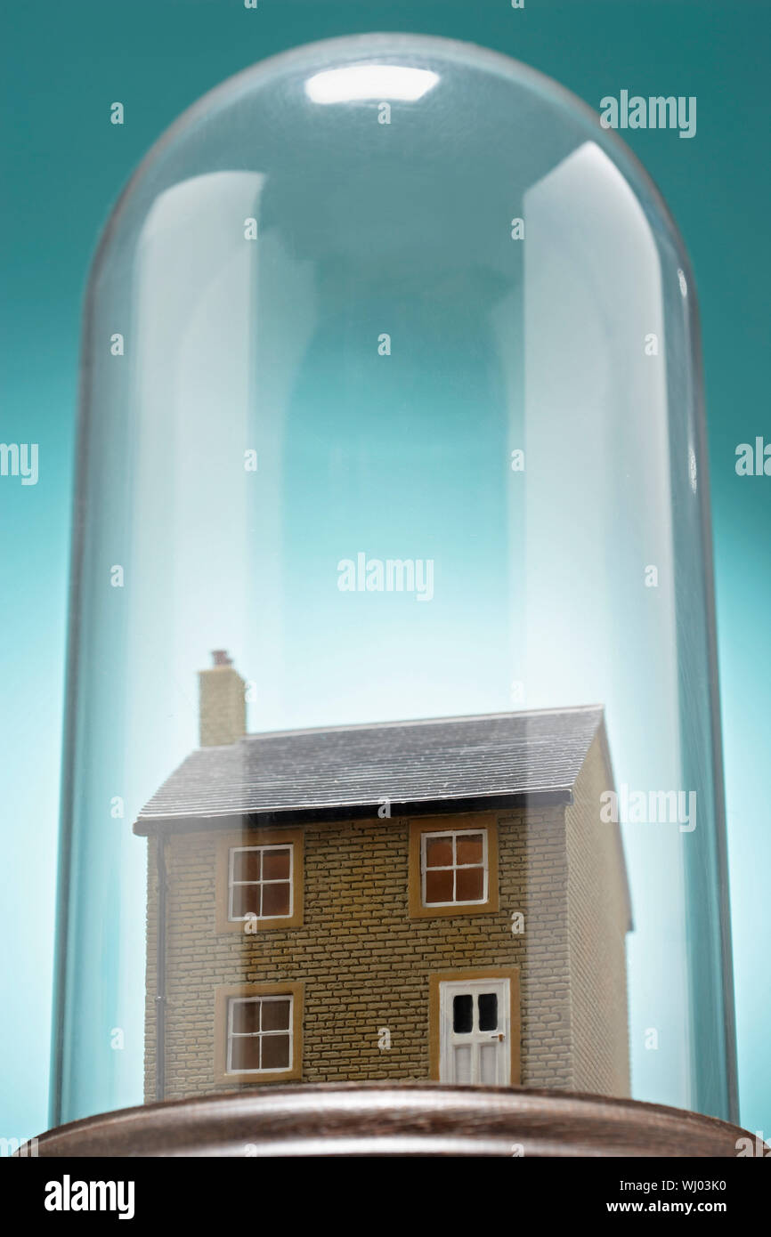 Small model house under glass cover Stock Photo - Alamy