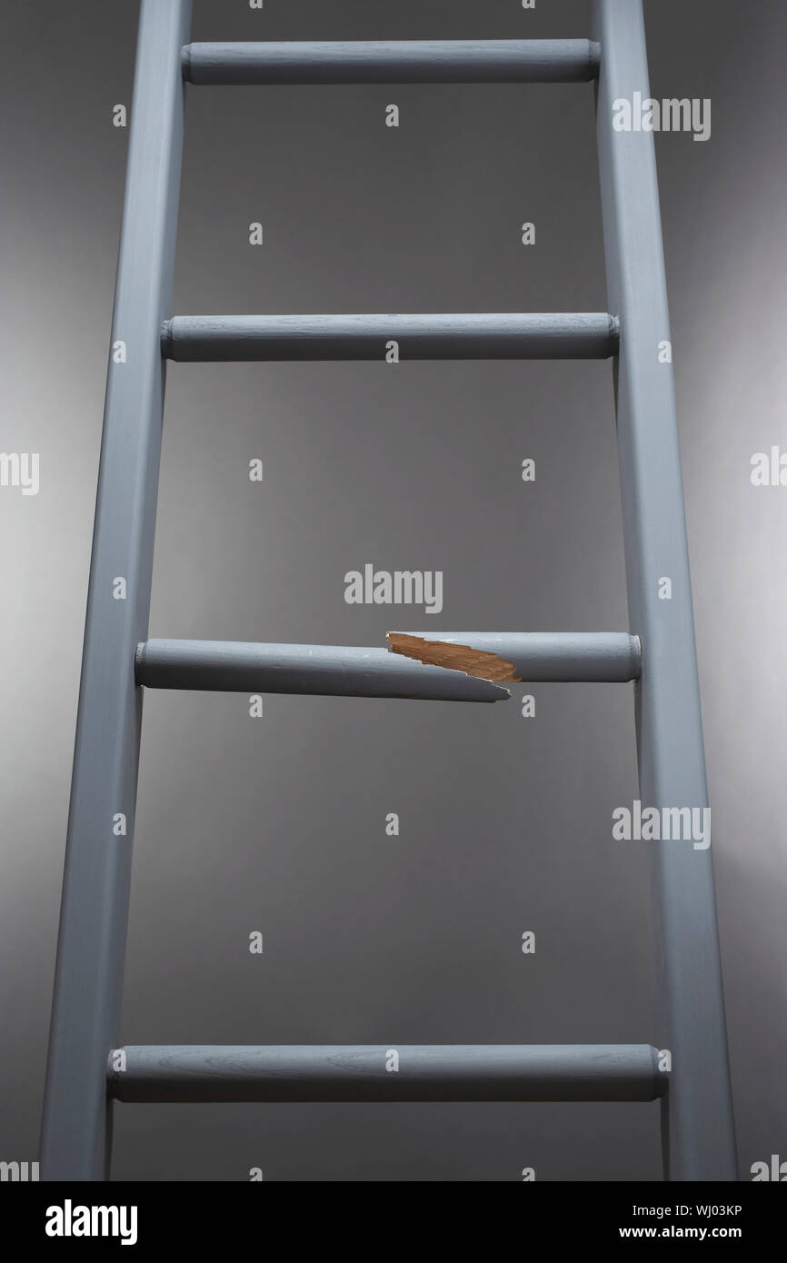 Ladder with one step broken Stock Photo - Alamy