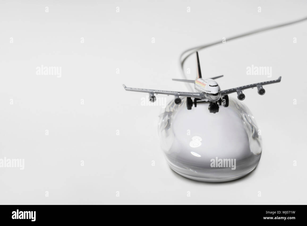 Jumbo jet on apple macintosh computer mouse, digital composite Stock ...