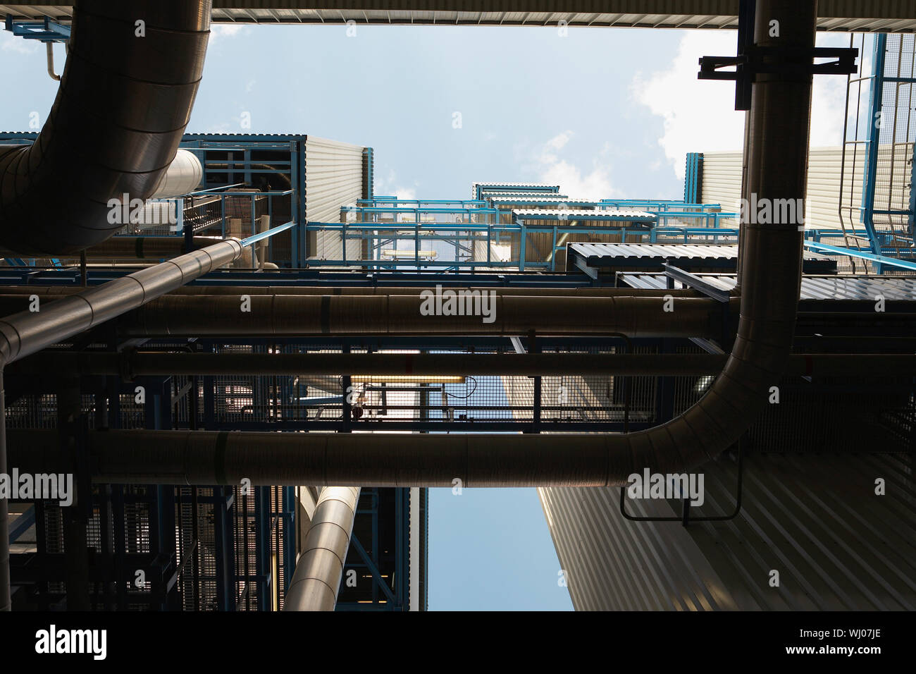 Low angle view of boiler complex of oil fired power station Stock Photo ...
