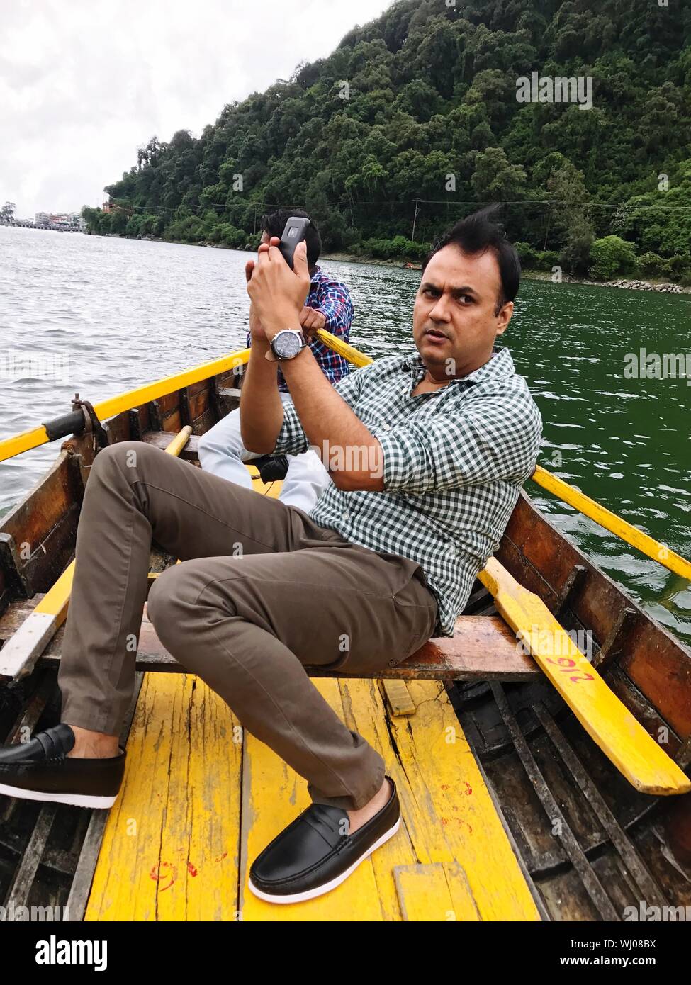 Indian man sitting on boat hi-res stock photography and images - Alamy