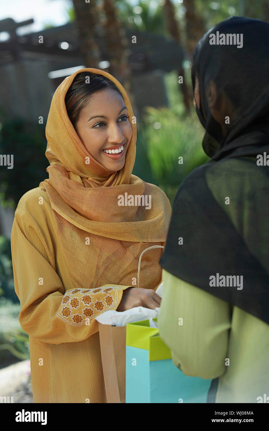 Two young muslim women talking outdoors Stock Photo - Alamy