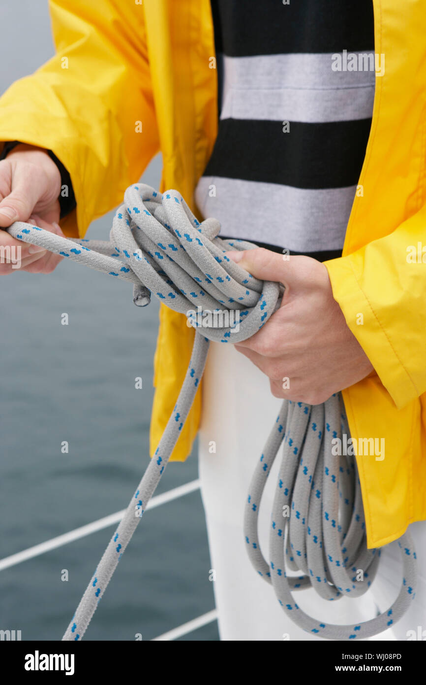 Man on yacht tying hi-res stock photography and images - Alamy