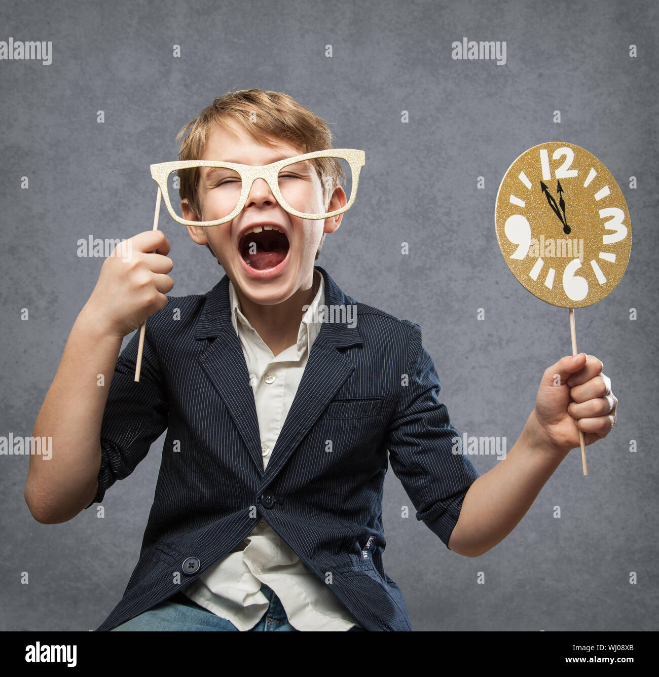 Boy holding clock hi-res stock photography and images - Alamy