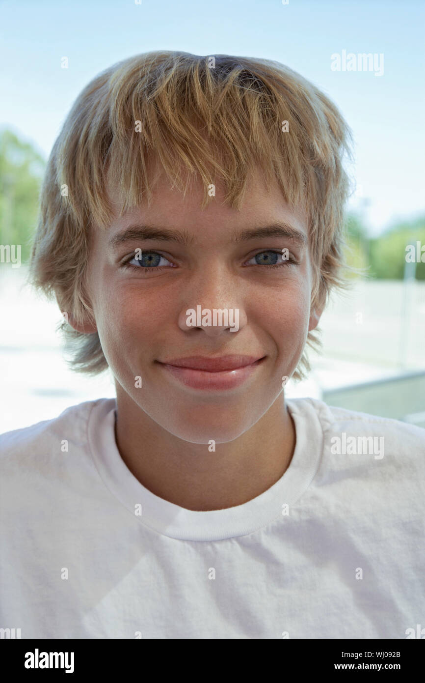 Closeup portrait of teenage boy smiling in skate park Stock Photo - Alamy