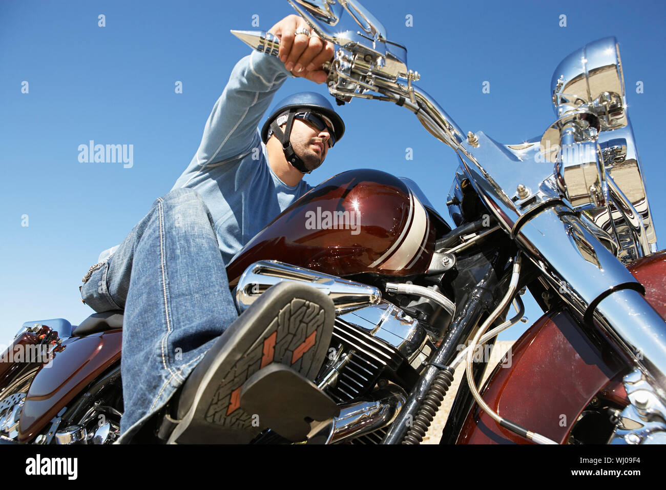 Biker riding motorcycle low angle hi-res stock photography and images ...