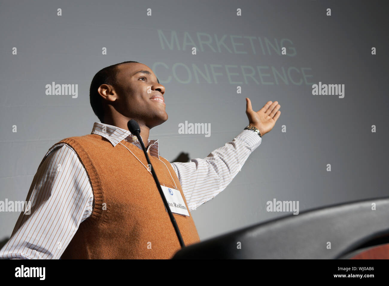 Gesturing leadership communication microphone standing hi-res stock ...