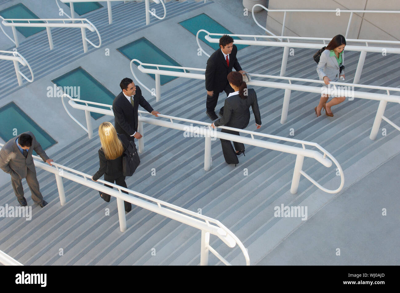 Business people moving up and down stairs, elevated view Stock Photo ...