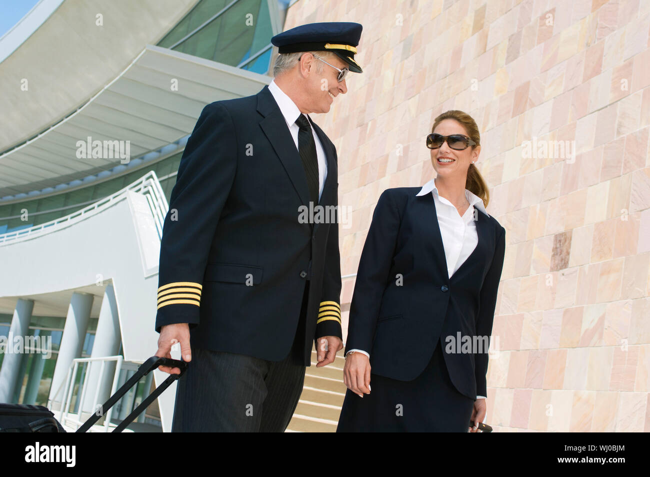 People talking to flight attendant hi-res stock photography and images ...