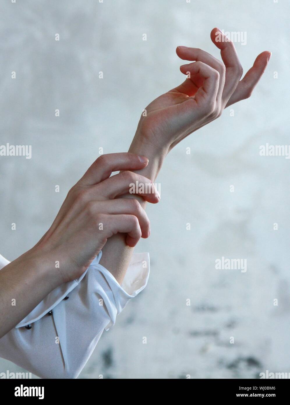 Calming movement of female's thin soft hands Stock Photo - Alamy