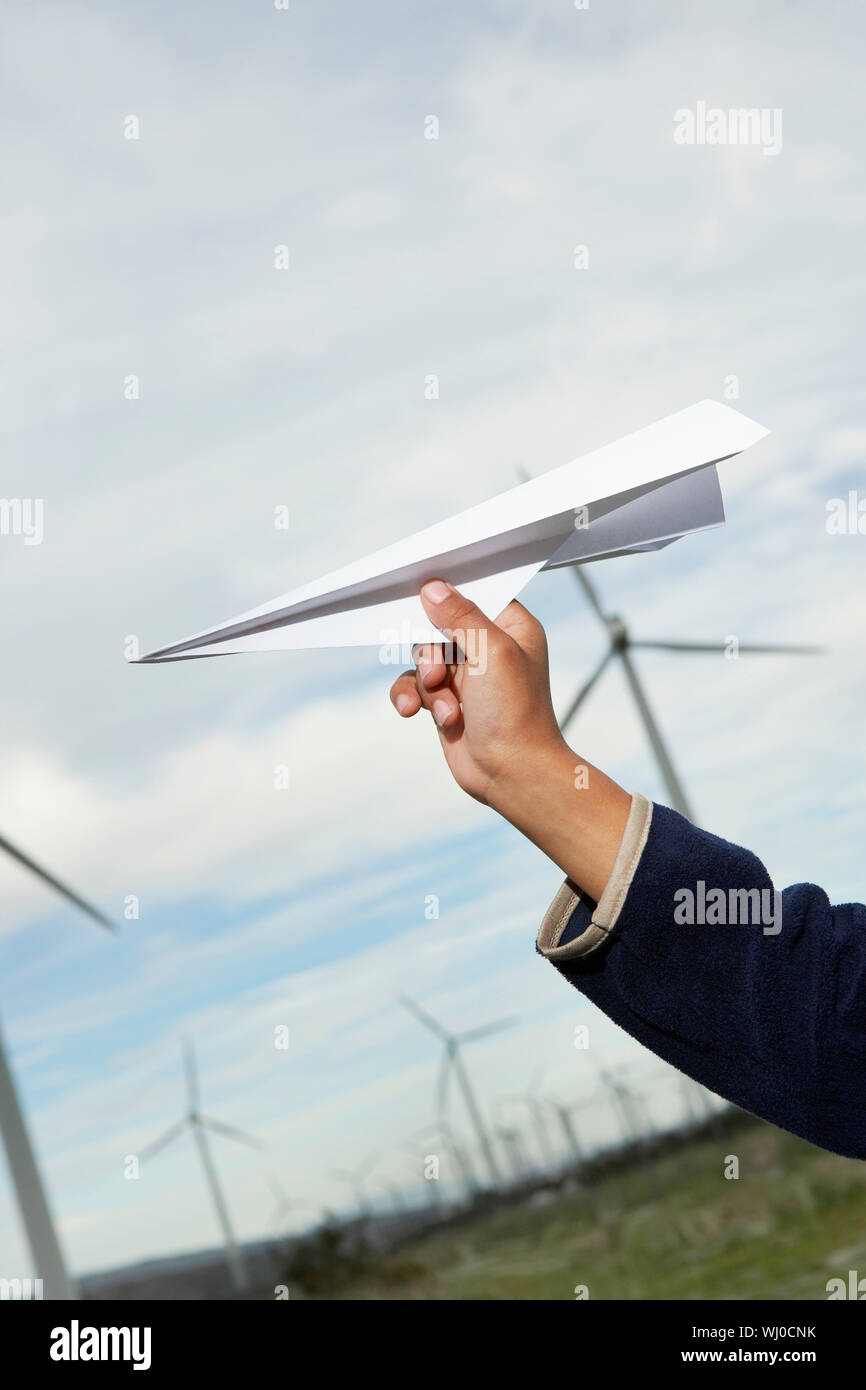 Hand holding paper plane close up hi-res stock photography and images ...