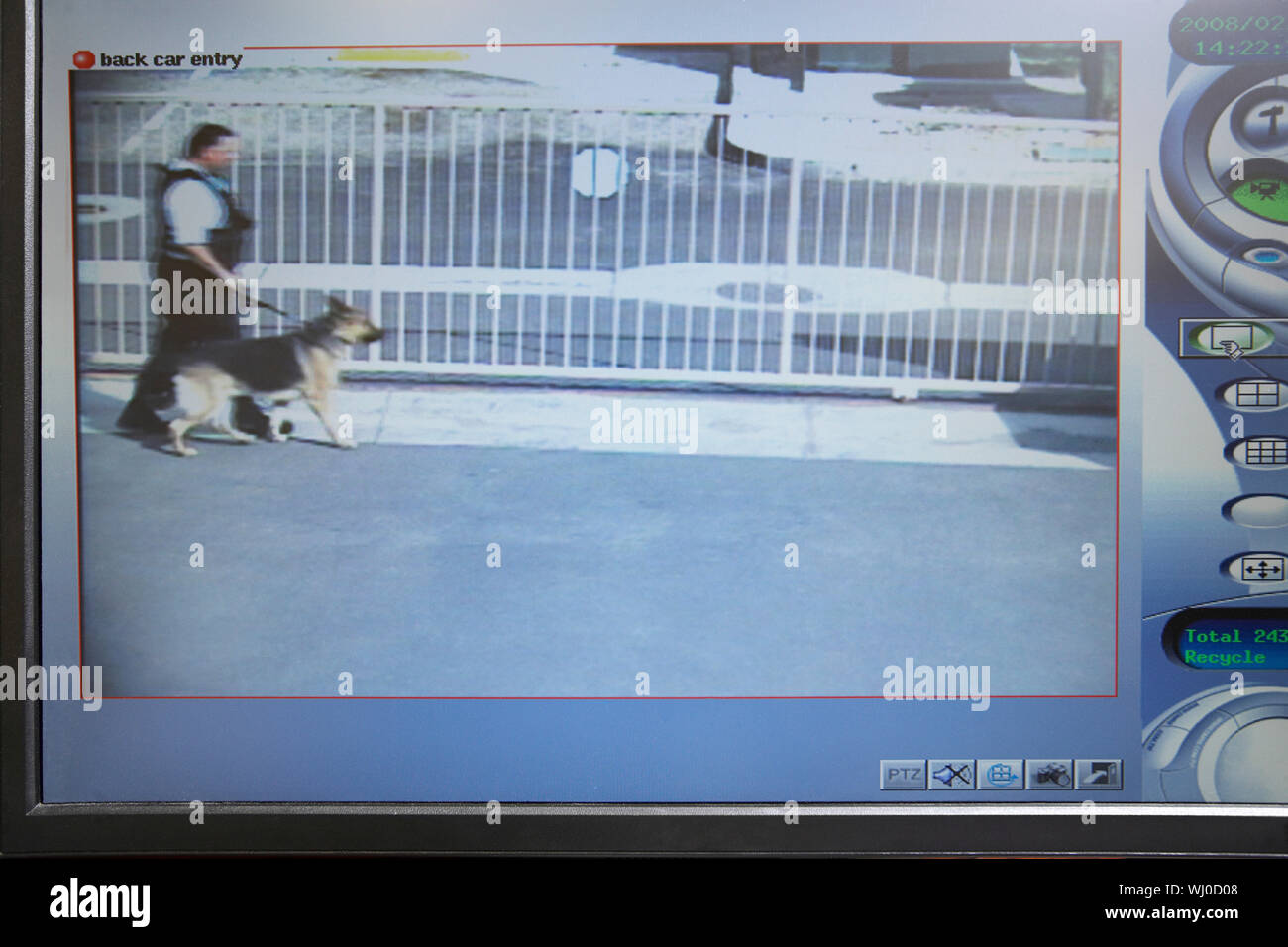 Guard with dog seen on picture from security camera Stock Photo - Alamy