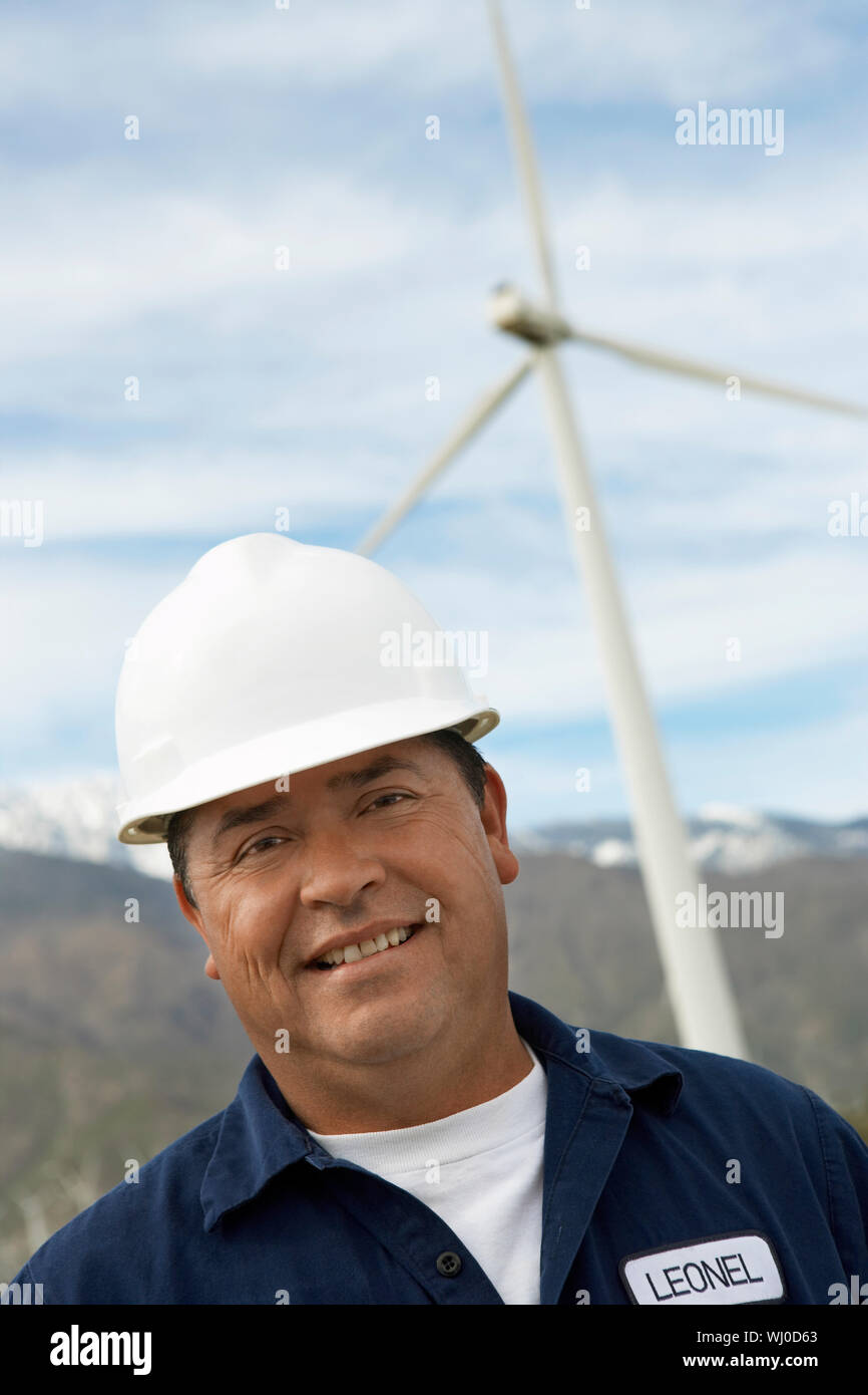 Engineer wearing hardhat at wind farm, portrait Stock Photo - Alamy