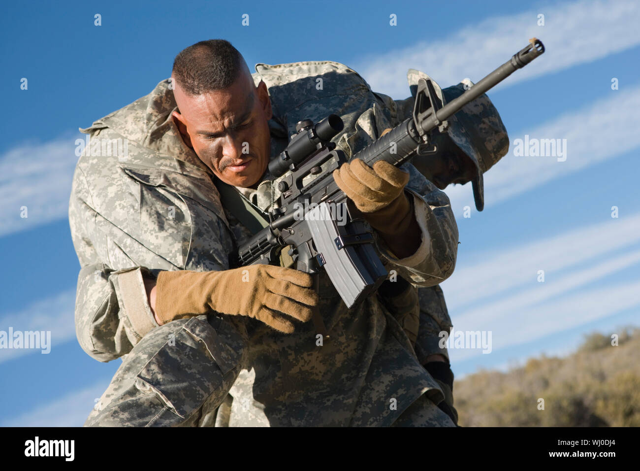 Full length soldier carrying hi-res stock photography and images - Alamy