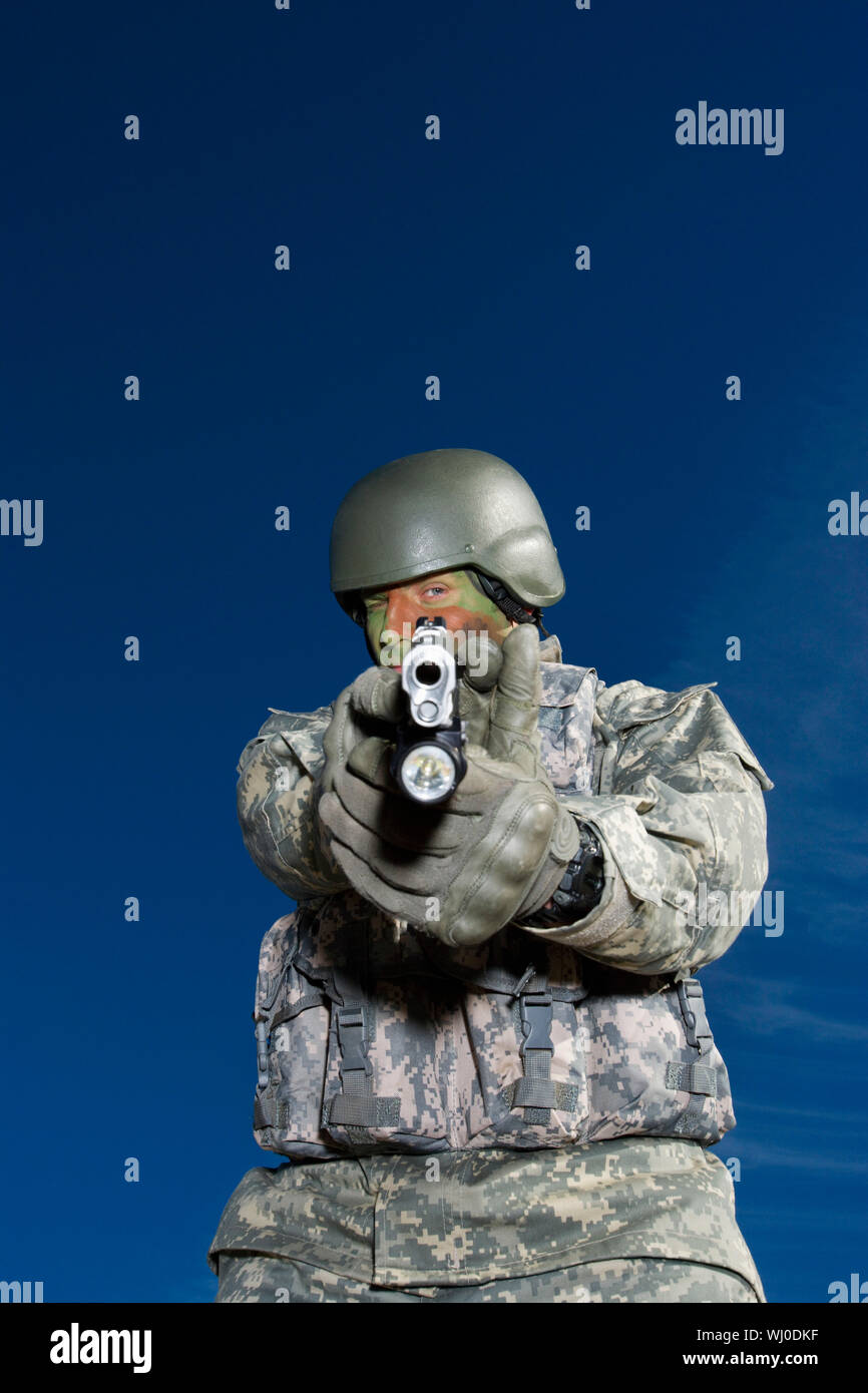 Portrait of soldier aiming to camera Stock Photo - Alamy