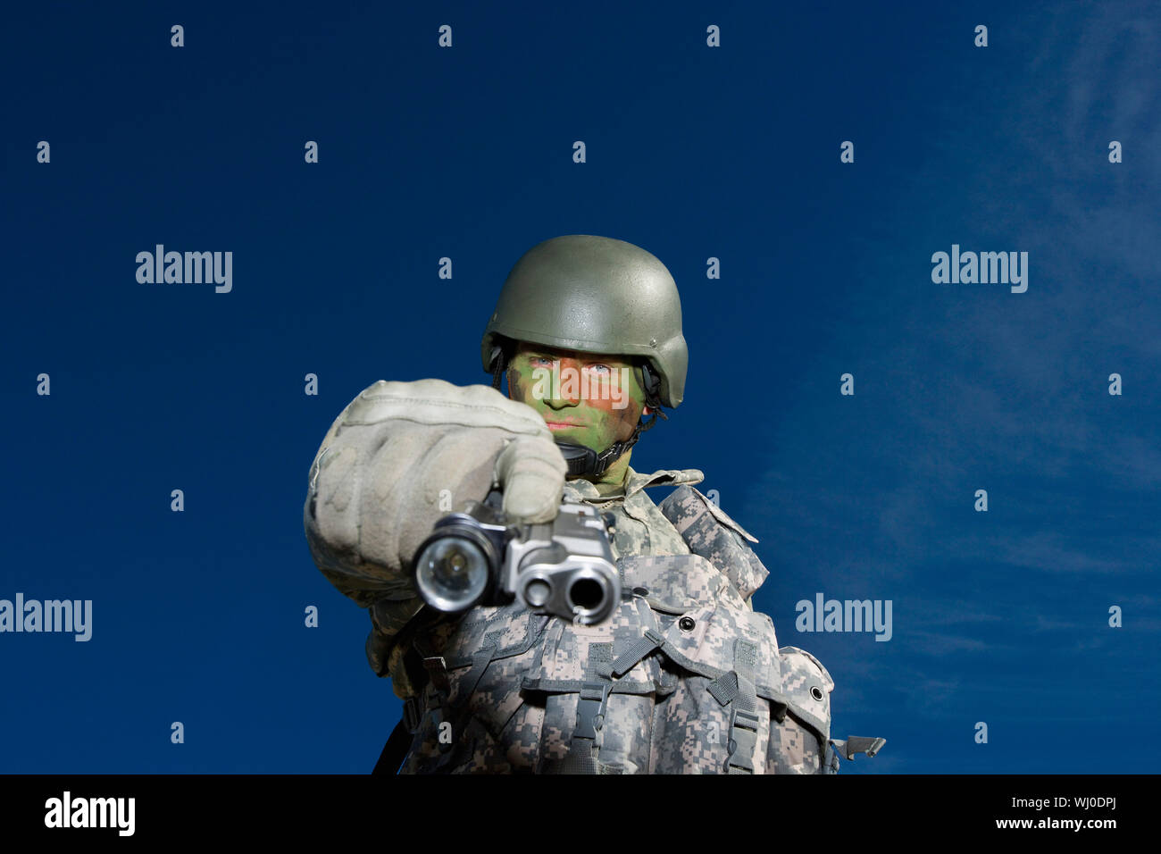 Portrait of soldier aiming to camera Stock Photo - Alamy