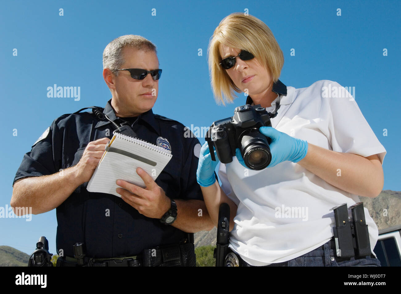 Police man holding notepad hi-res stock photography and images - Alamy