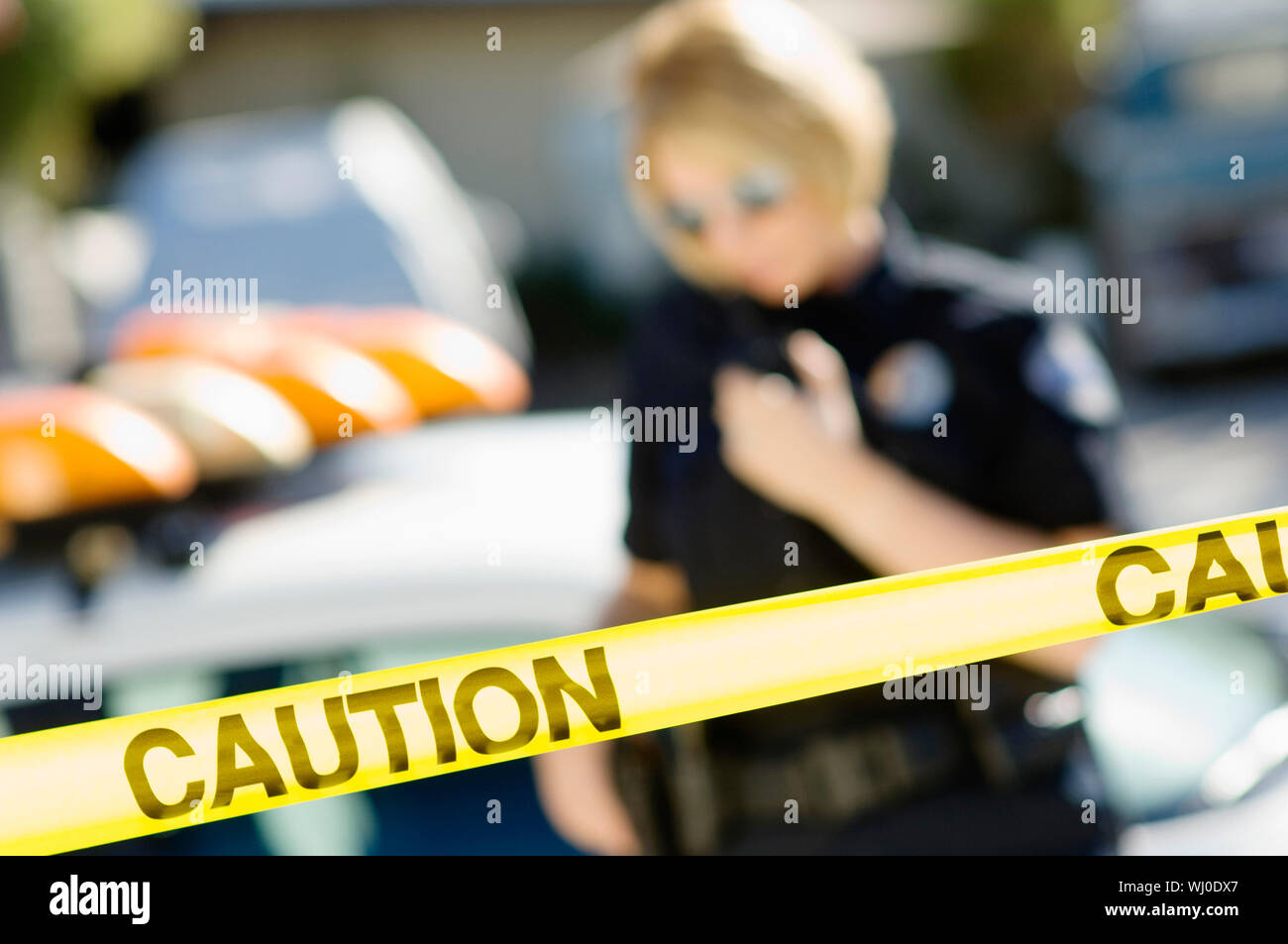 Police Officer Using Two-Way Radio Stock Photo - Alamy