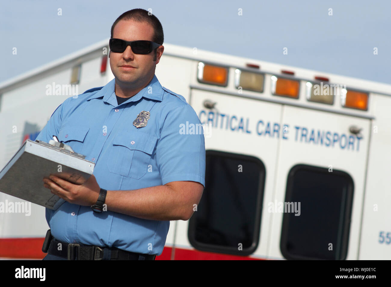 Portrait of paramedic in front of ambulance Stock Photo - Alamy