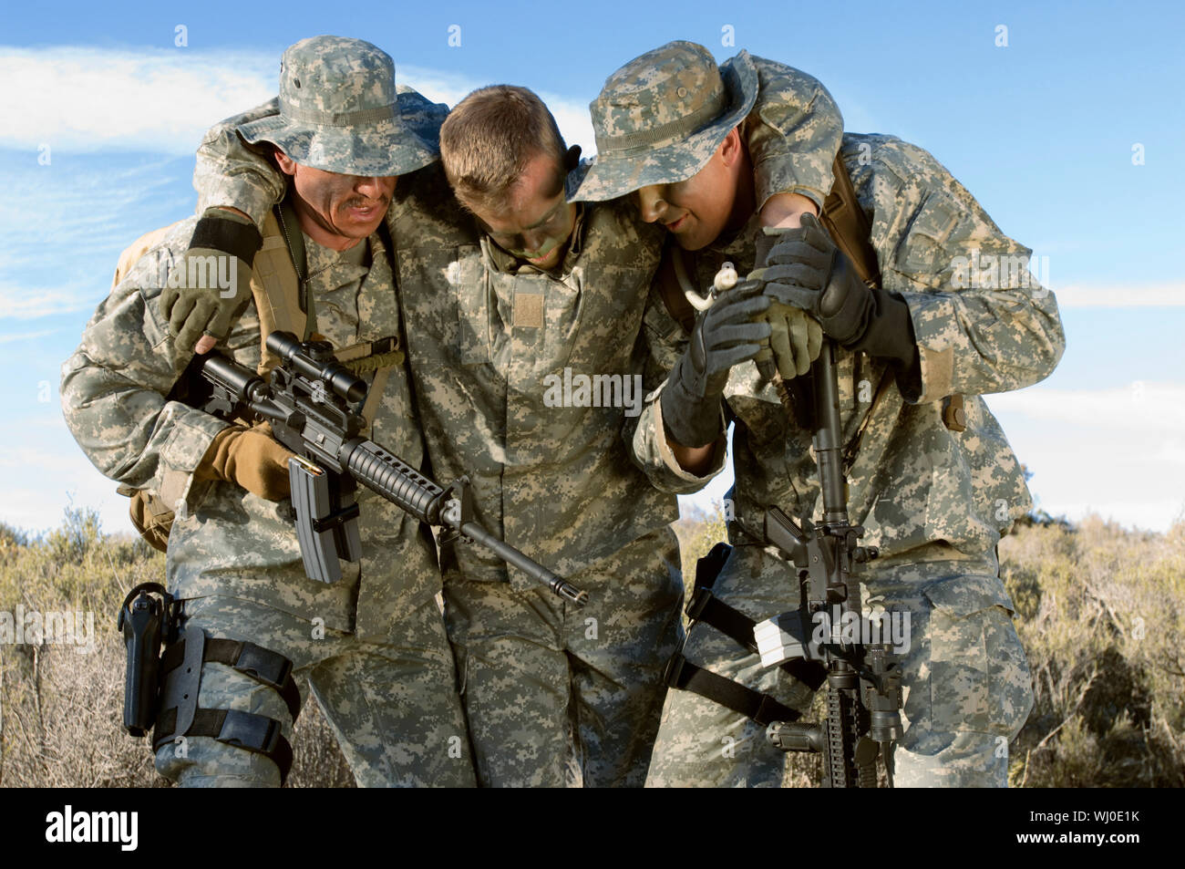 Military army soldier injured carrying hi-res stock photography and ...